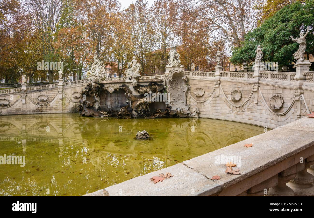The monumental Fountain of Twelve Months, surrounded by trees in ...