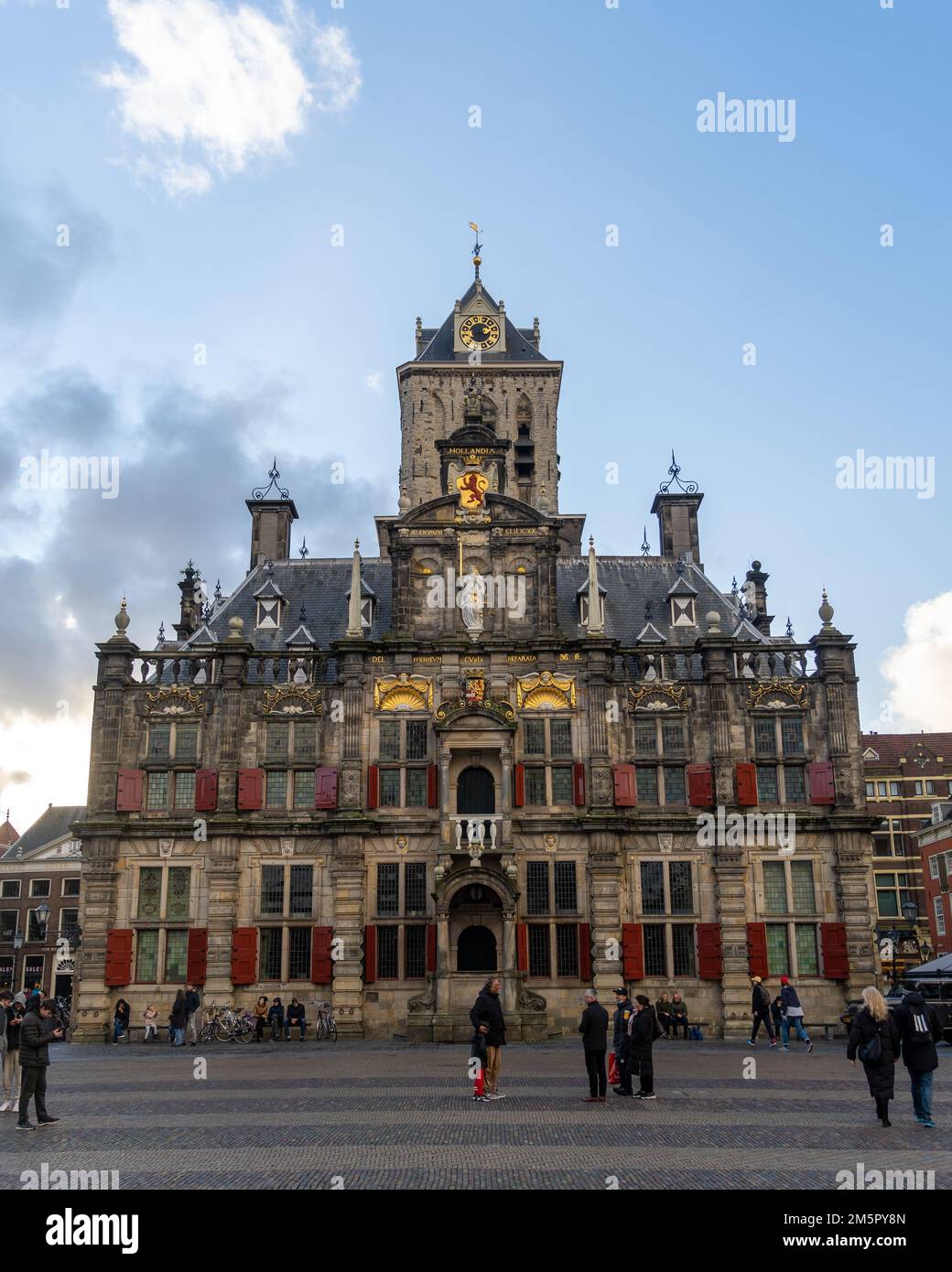 Delft city hall and market square during golden hour, Delft, Holland ...