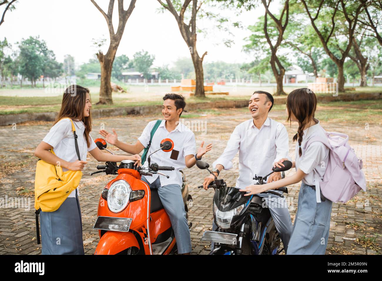 Boy boys male girl girls female friends student students hi-res stock ...