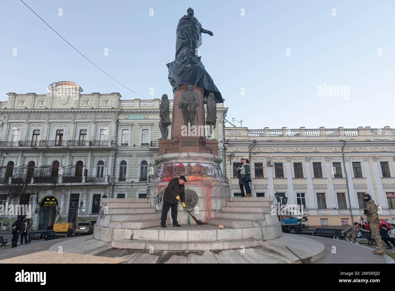 A worker sweeps the pedestal of Catherine's II monument after removing ...