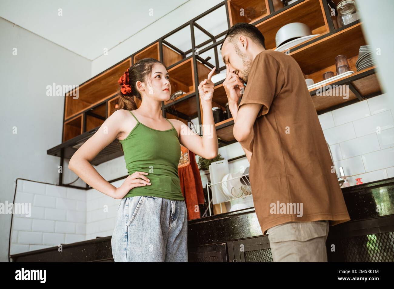 young woman getting angry at man while fighting Stock Photo - Alamy