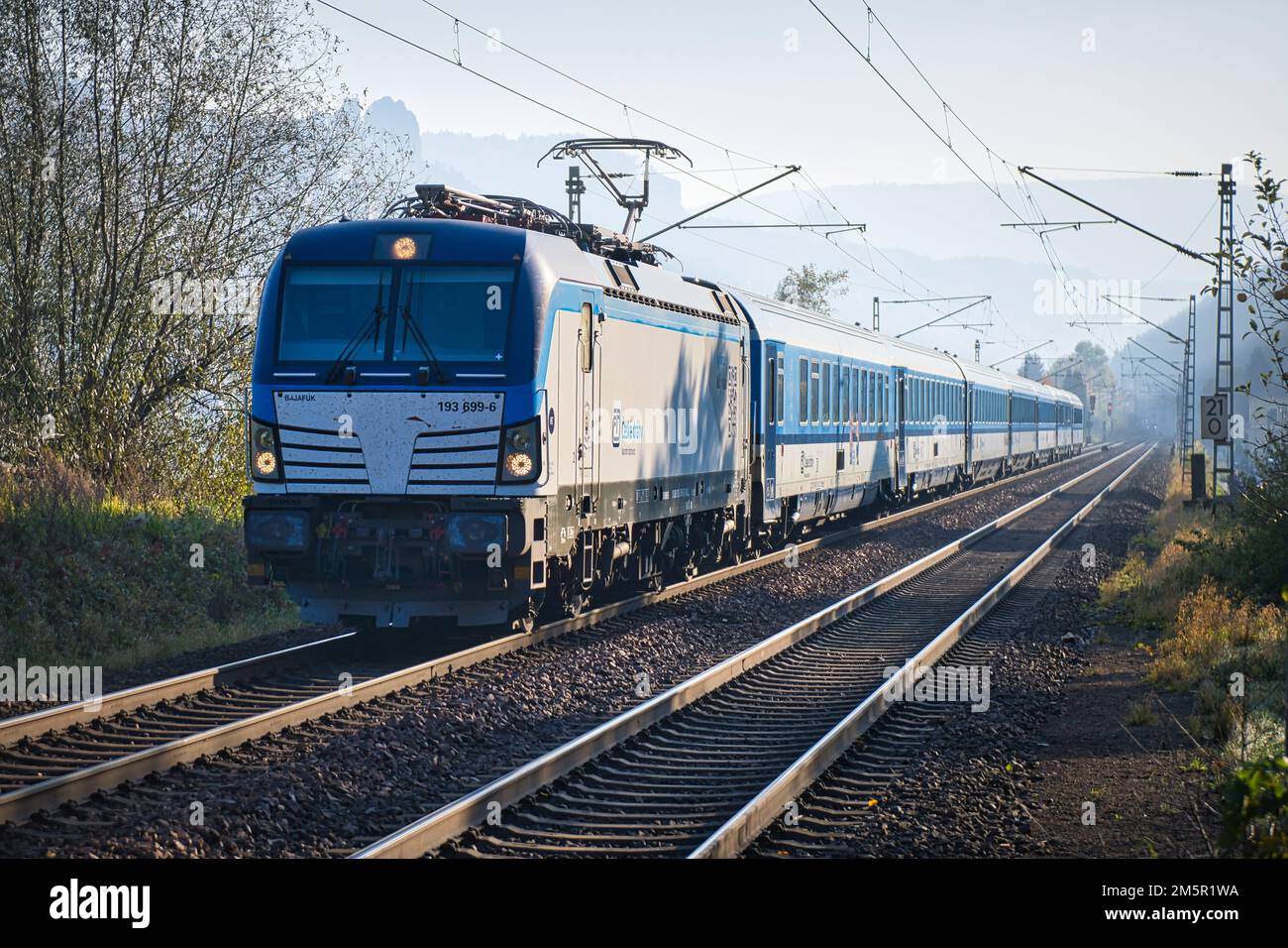 A class 193 (193 699 "BAJAFUK") locomotive, pulls a Eurocity through ...