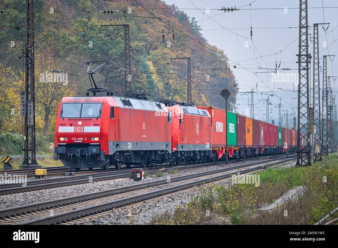 A DB Cargo class 152 (152 086) locomotive pulls a freight train with ...