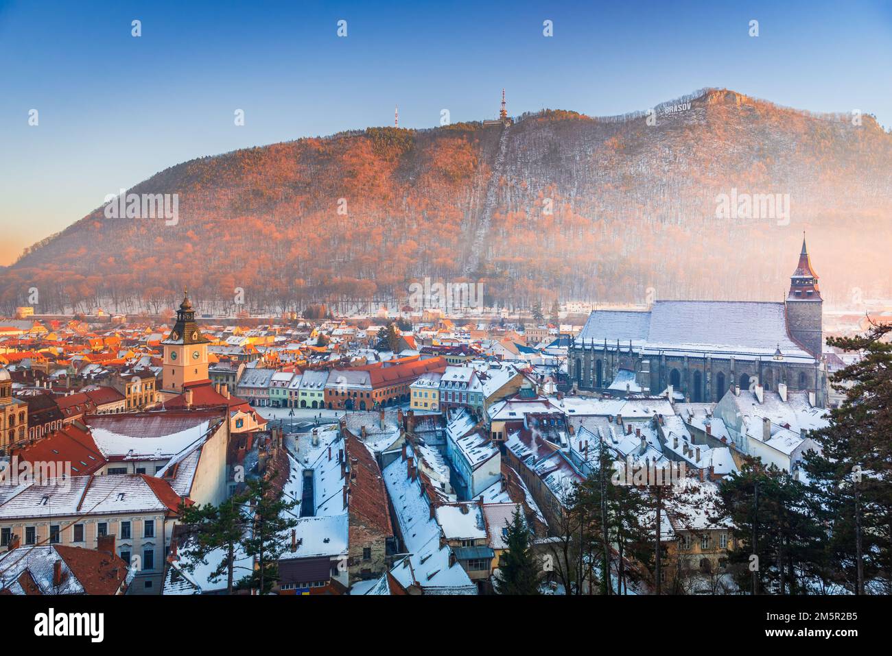 Brasov, Romania. Black Church, Council Square and Carpathian Mountains ...