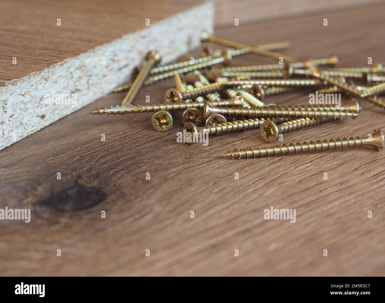wood screws on melamine manufactured wood panel Stock Photo - Alamy