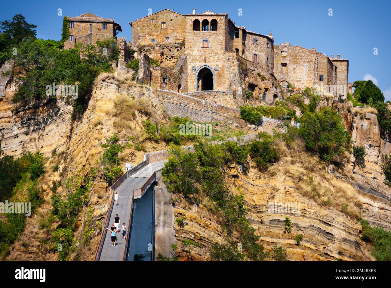 Pedestrian bridge ascending to medieval Civita di Bagnoregio hilltop ...