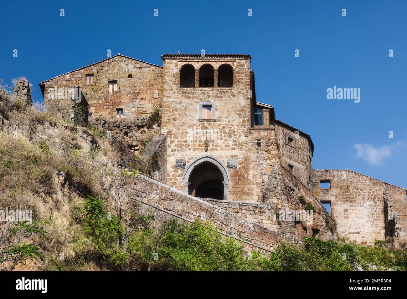Gothic pointed arch of Santa Maria Gate with Romanesque triple loggia ...