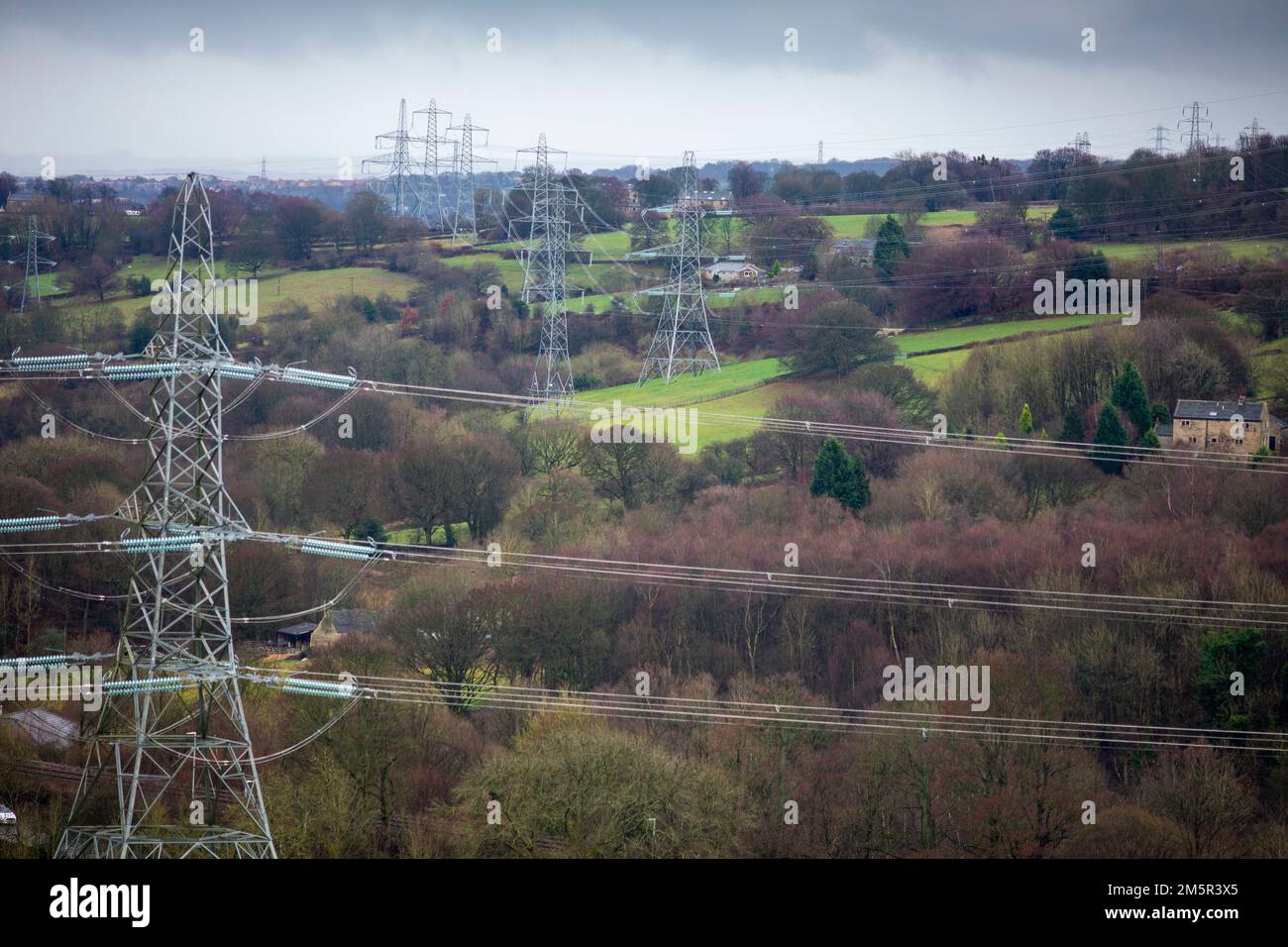 West Yorkshire, UK. 30th Dec, 2022. Electricity pylons cross a valley ...