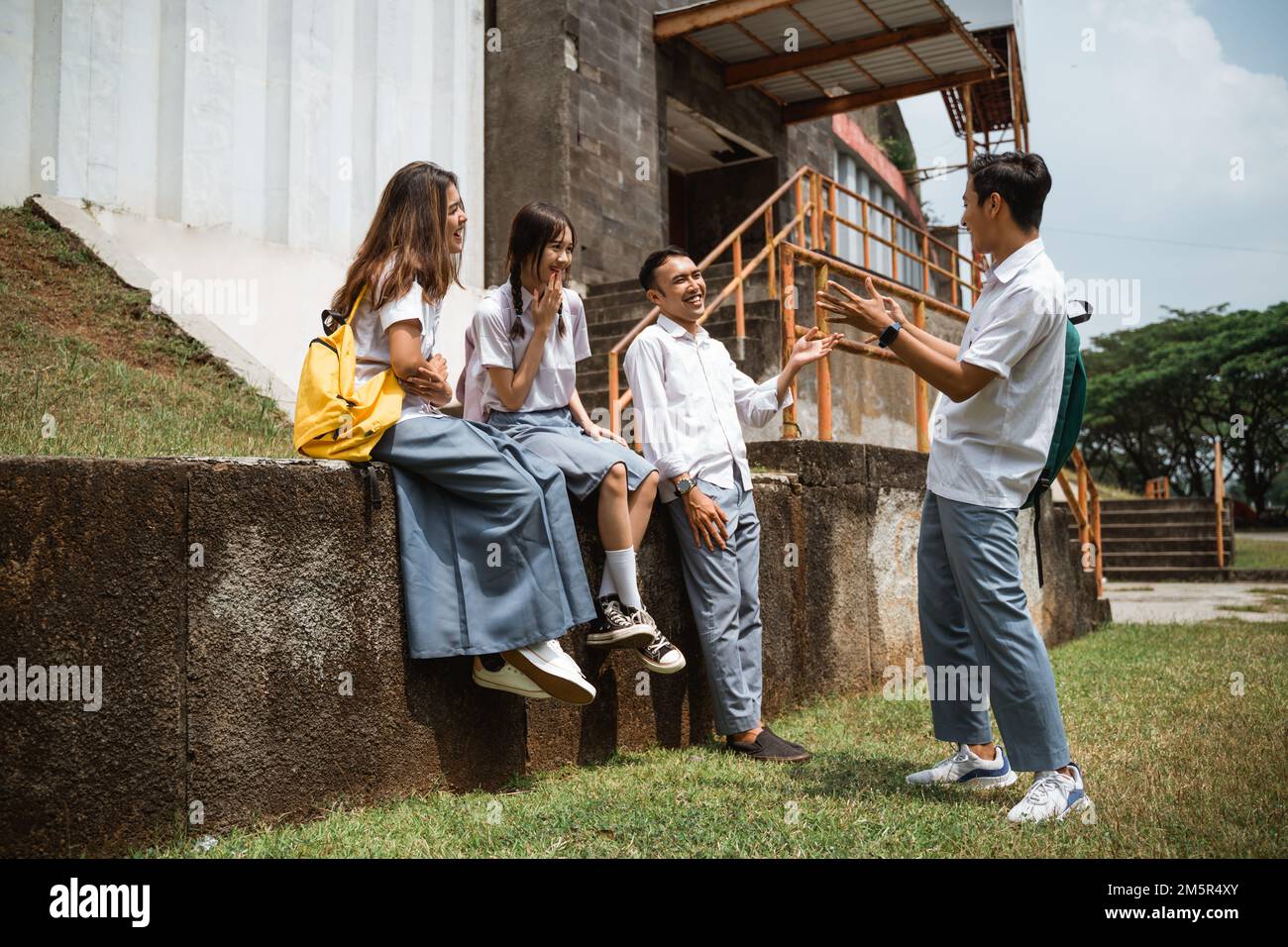 Asian high school students meet and talk to each other Stock Photo - Alamy