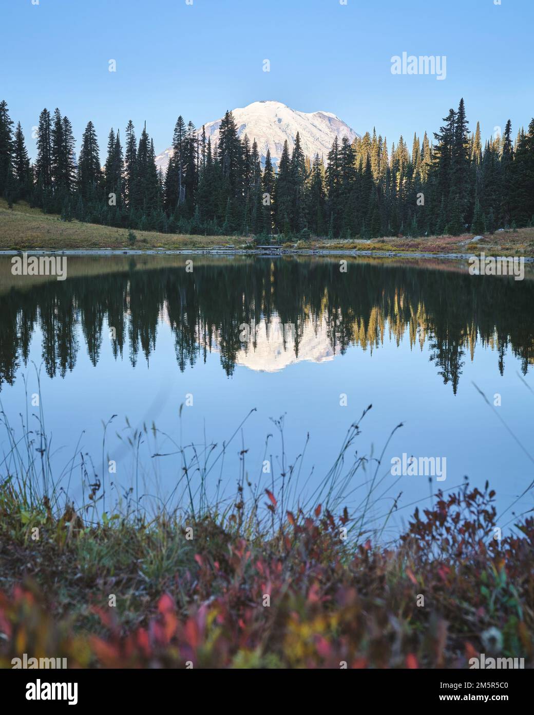 The Mount Rainier with reflection on the lake with blue sky on the ...
