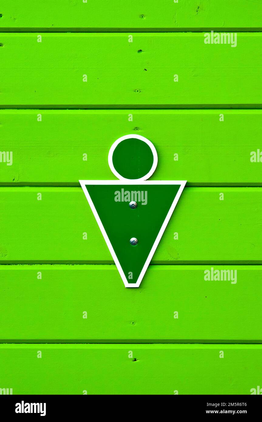 Men WC sign on green wall Stock Photo - Alamy