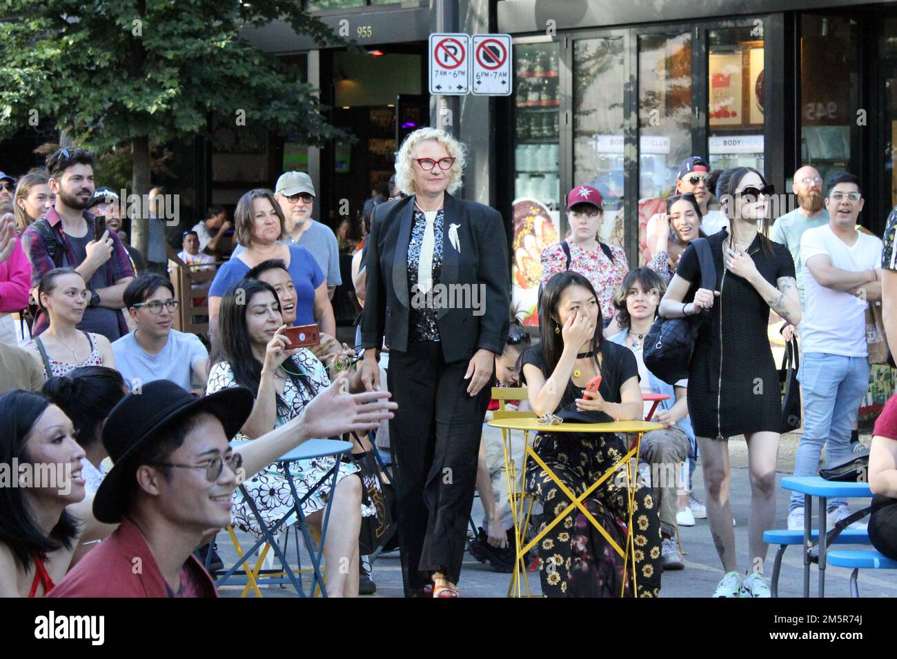 The fashion models and audience during a show in public on Granville ...