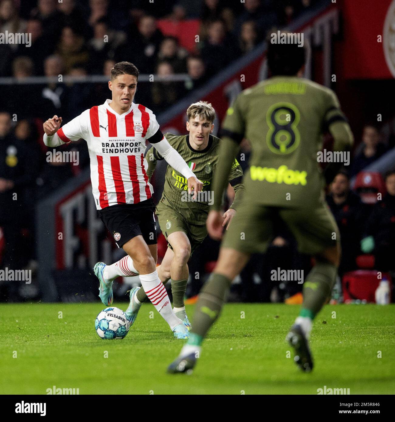 EINDHOVEN Joey Veerman of PSV, Alexis Saelemaekers Of AC Milan against ...