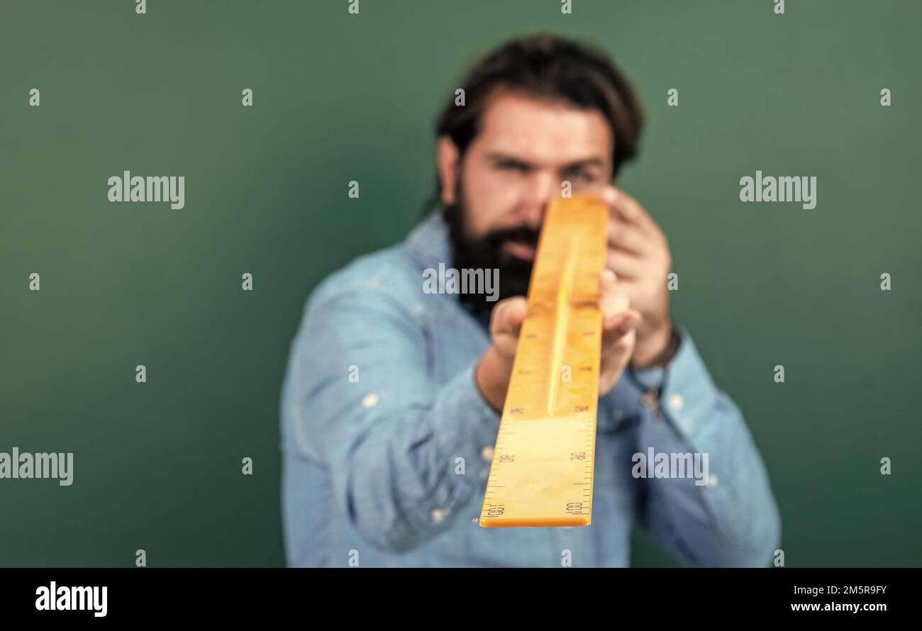 man serious with size measured on ruler math tool, size concept ...