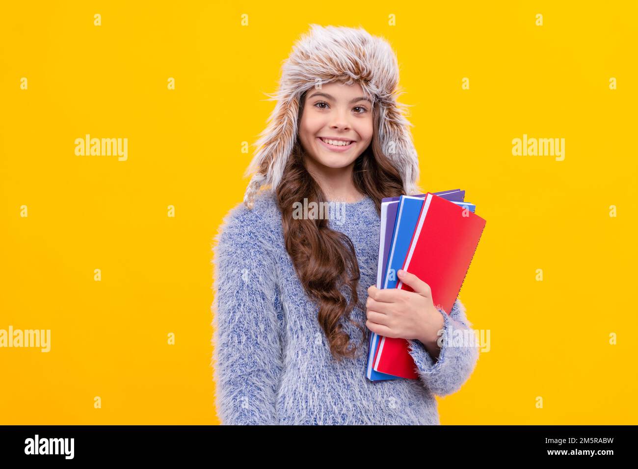 teen girl in knitwear on yellow background. portrait of child wearing ...