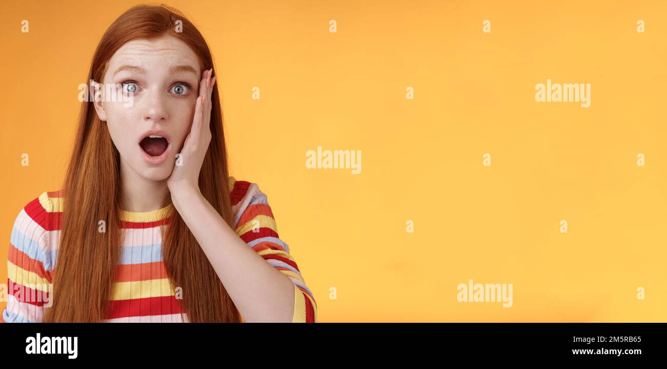 Shocked impressed concerned ginger girl drop jaw gasping stunned slap ...