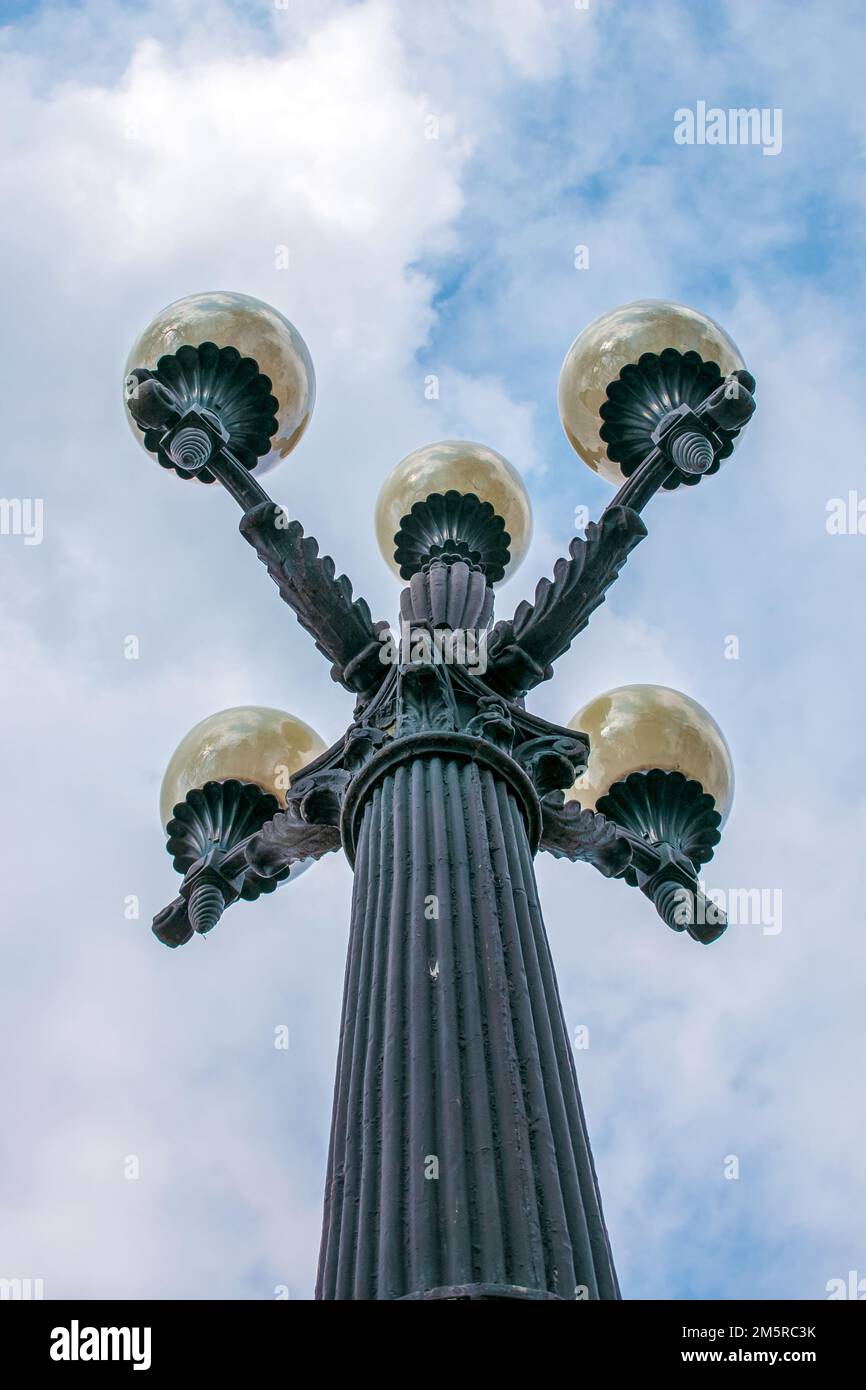 Street lamps on Metal pole against the background of cloudy blue sky by ...