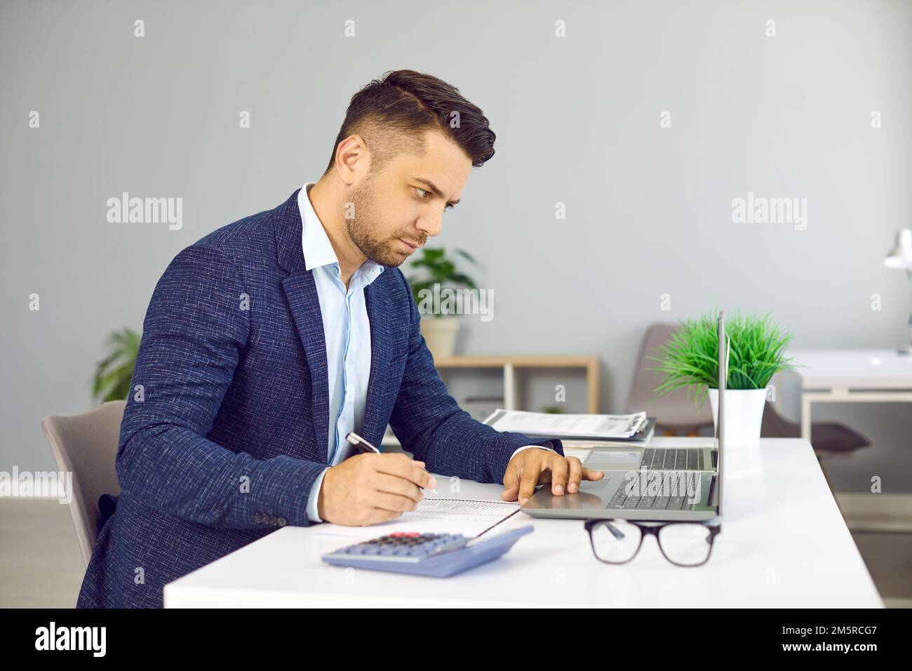 Serious male financial director of business company is engaged in ...