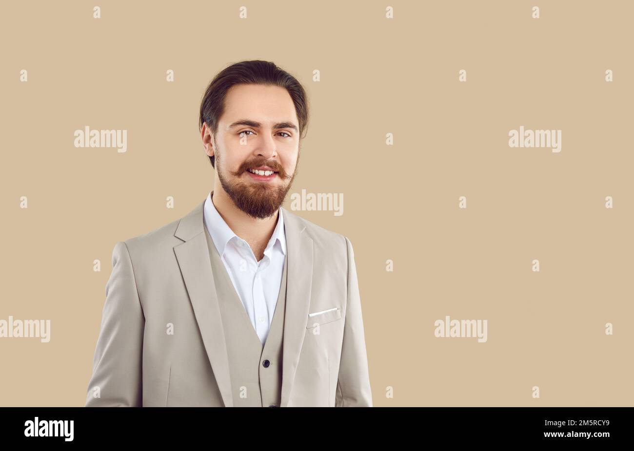 Successful smiling Caucasian man with mustache and beard posing in ...