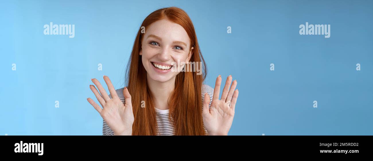 Charming redhead elder sister say goodbye sibling friends smiling ...