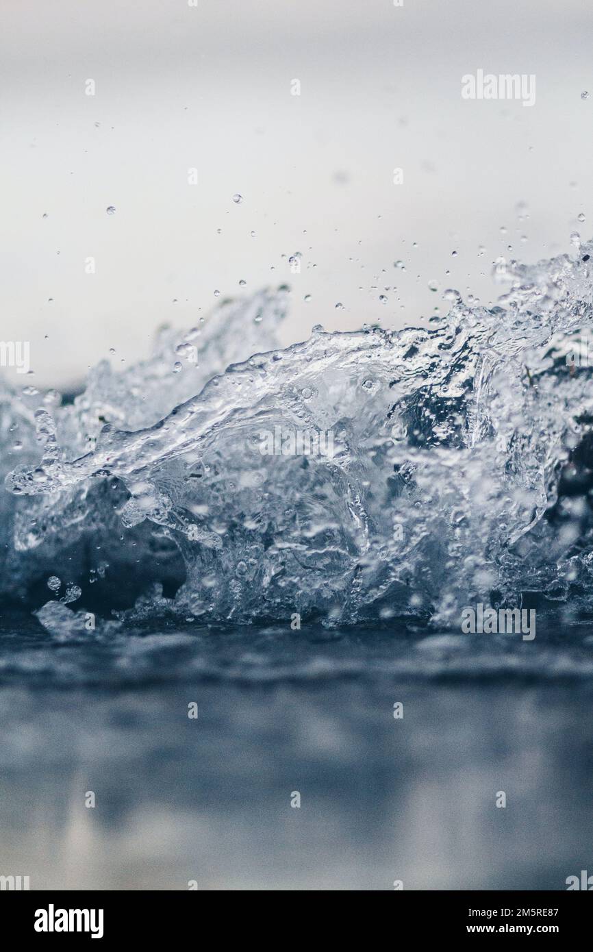 A vertical shot of water splash background Stock Photo - Alamy