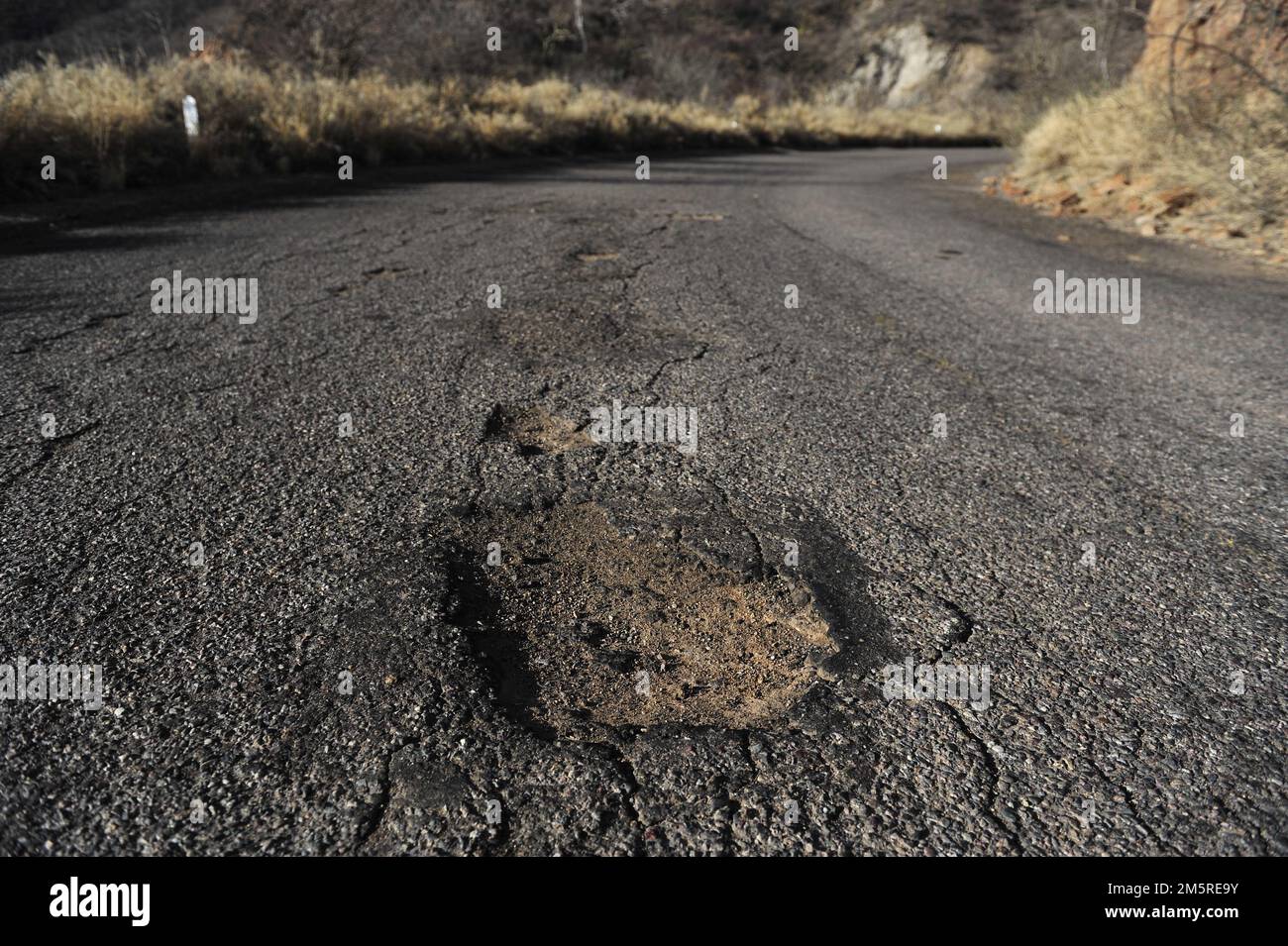 Sonora state highway in poor pavement condition due to potholes (Photo ...