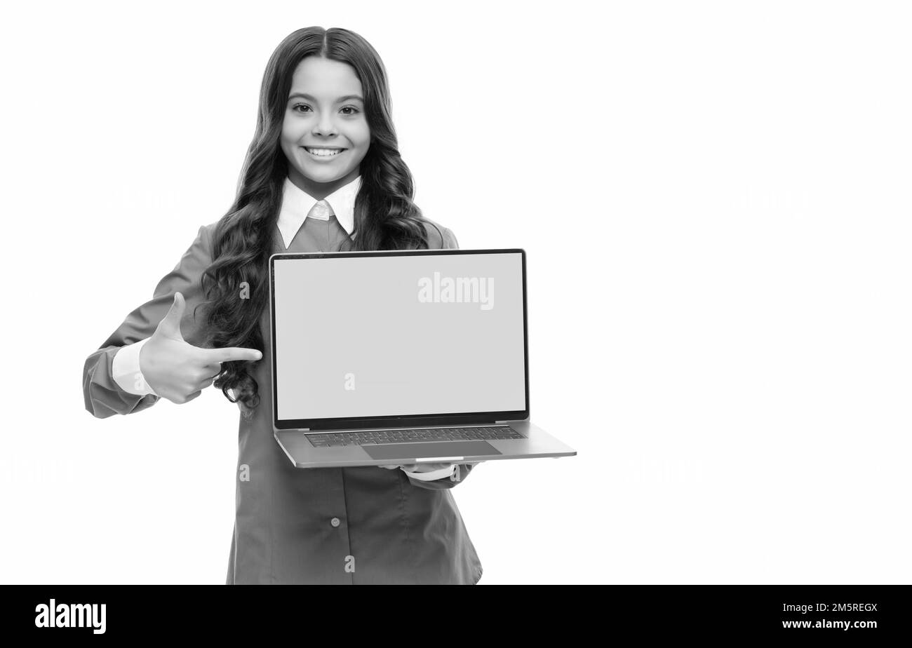 happy kid portrait make presentation point finger on laptop isolated on ...