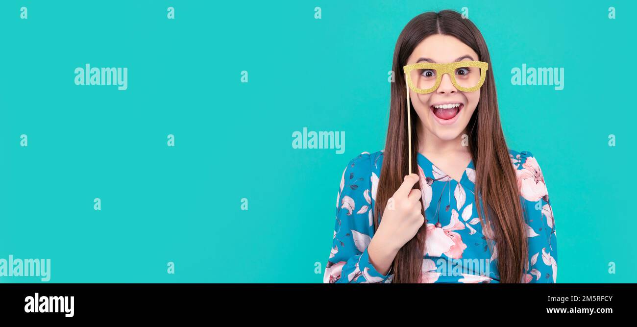 Make it fun. Funny girl hold prop glasses. Happy kid smile having fun ...