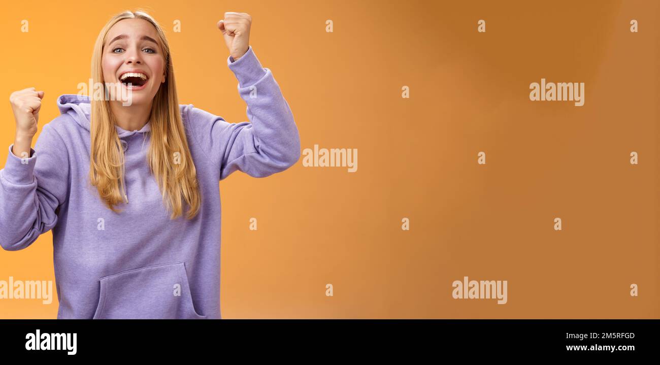 Happy cheerful young supportive woman cheering sister win smiling ...