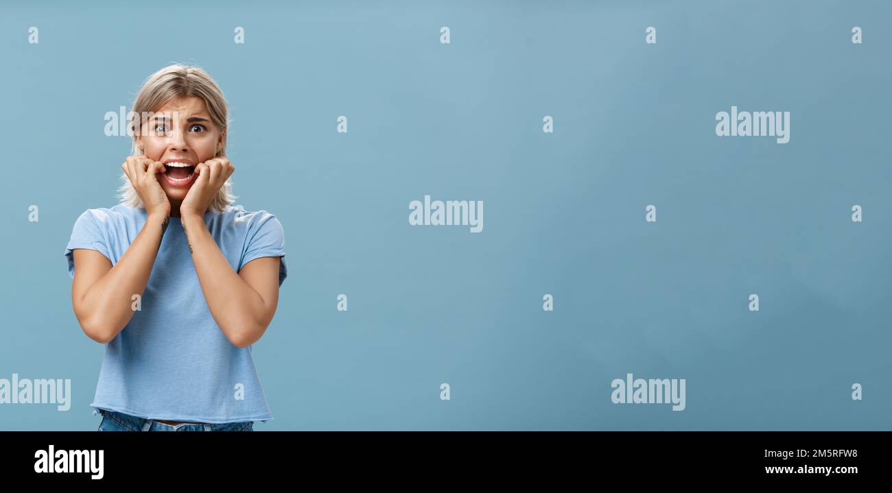 Indoor shot of shocked troubled girlfriend hearing mom returned home ...