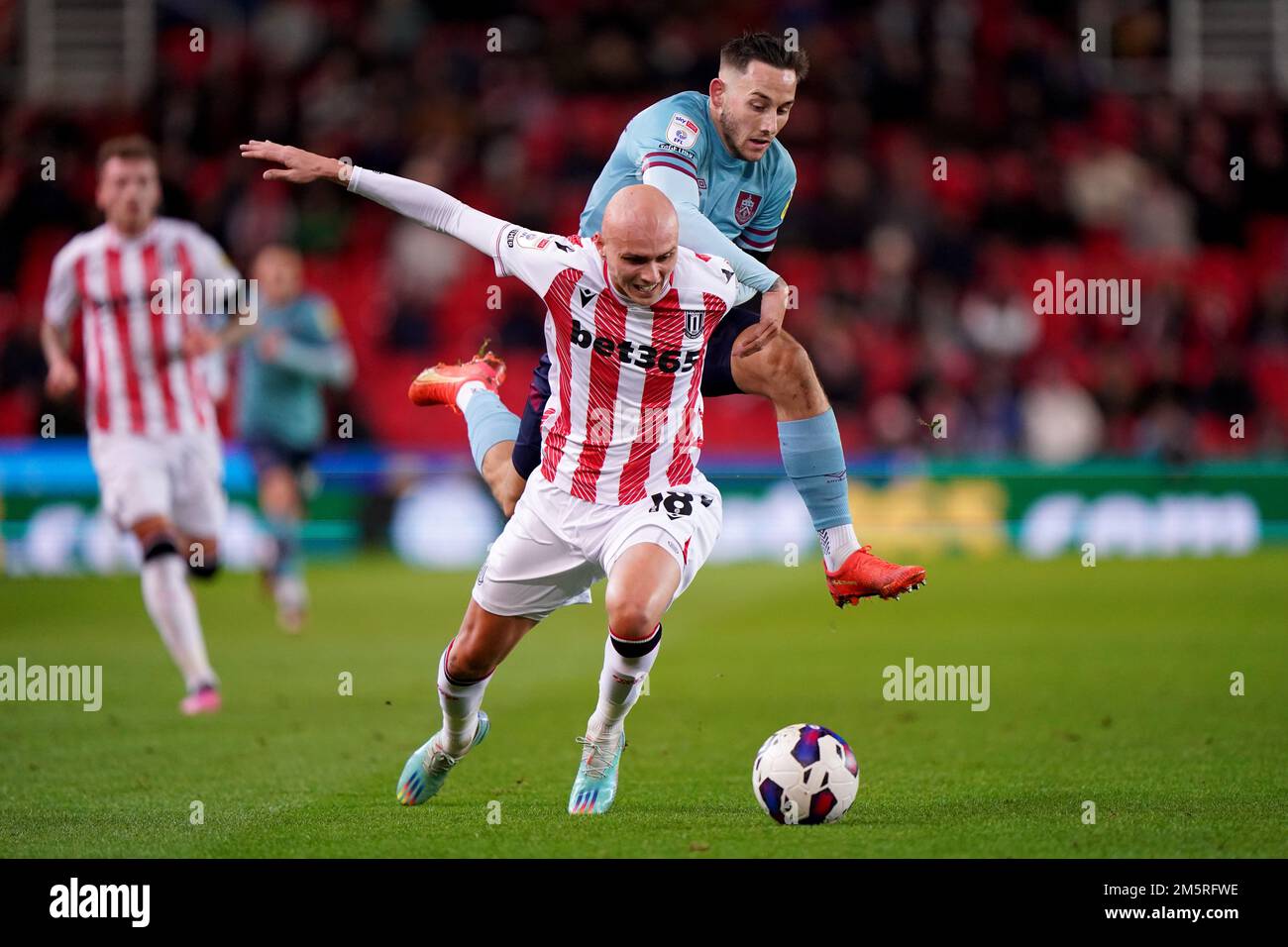 Stoke City’s Will Smallbone (below) and Burnley’s Josh Brownhill in ...