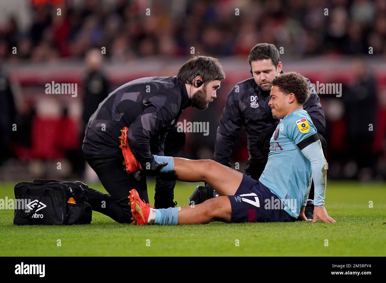 Burnley’s Manuel Benson receives medical attention during the Sky Bet ...