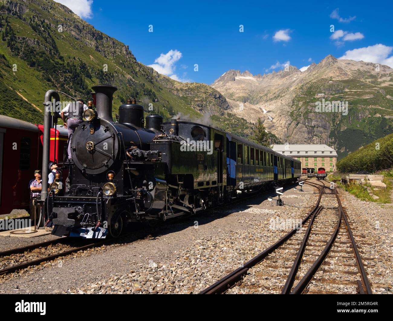Gletsch, Switzerland - July 15, 2022: A historic train with a steam ...