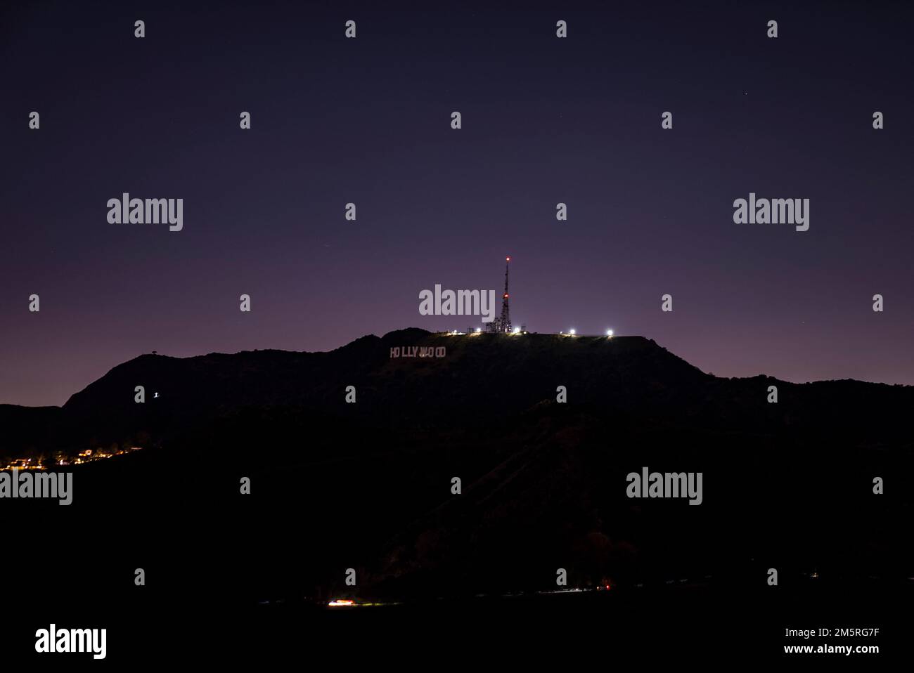 Hollywood sign with illuminated electricity pylon on Mount Lee at ...