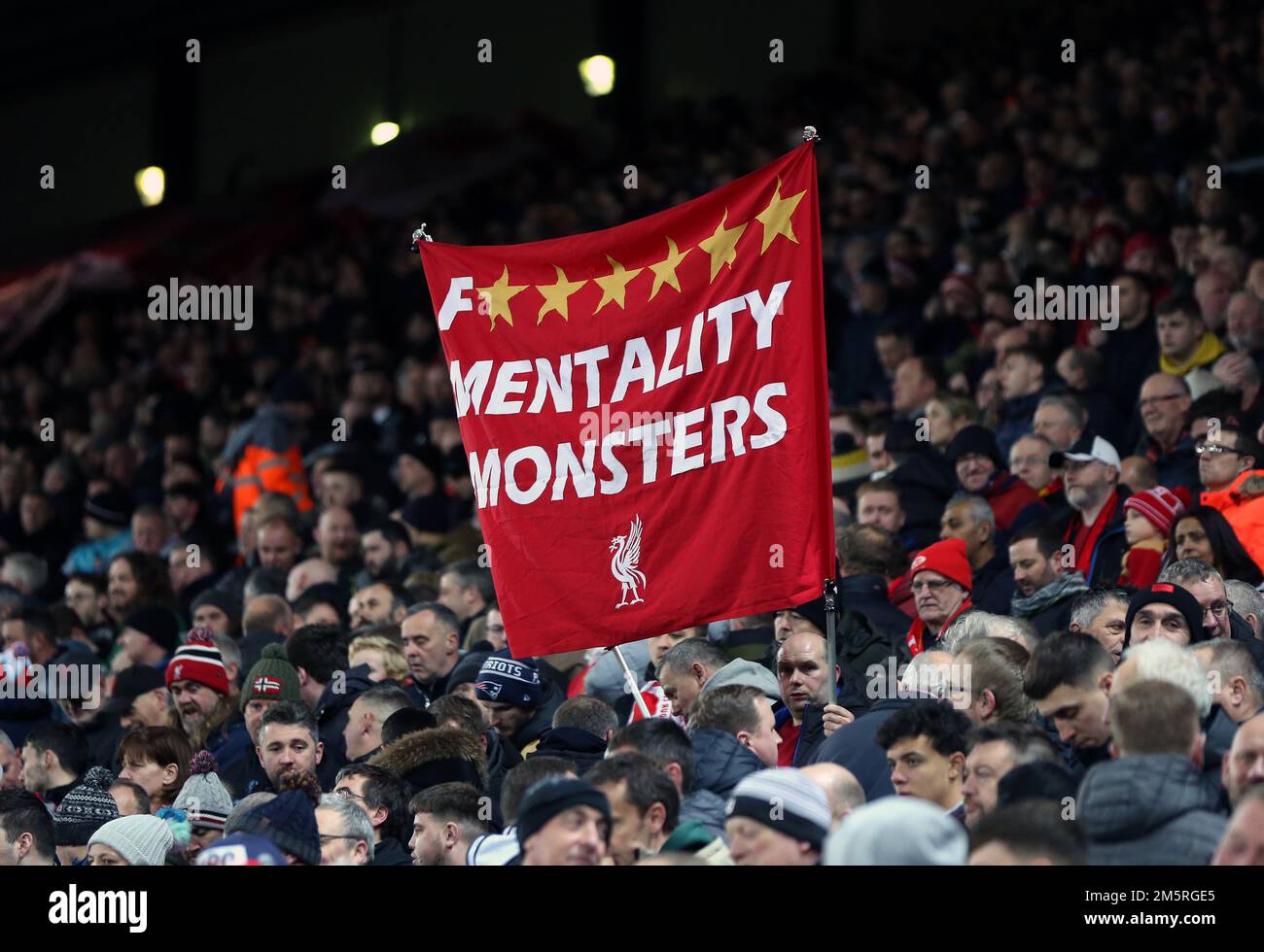 Liverpool fans hold up a Mentality Monsters banner ahead of the Premier ...