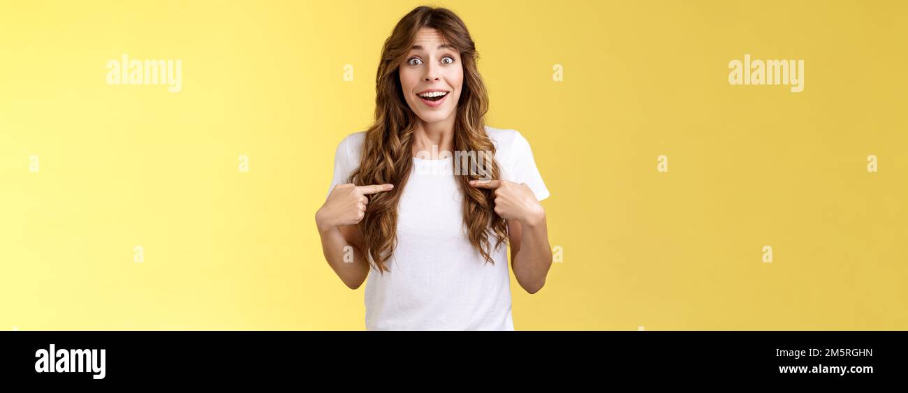 Surprised relieved pleased cute curly-haired girl receive promotion ...