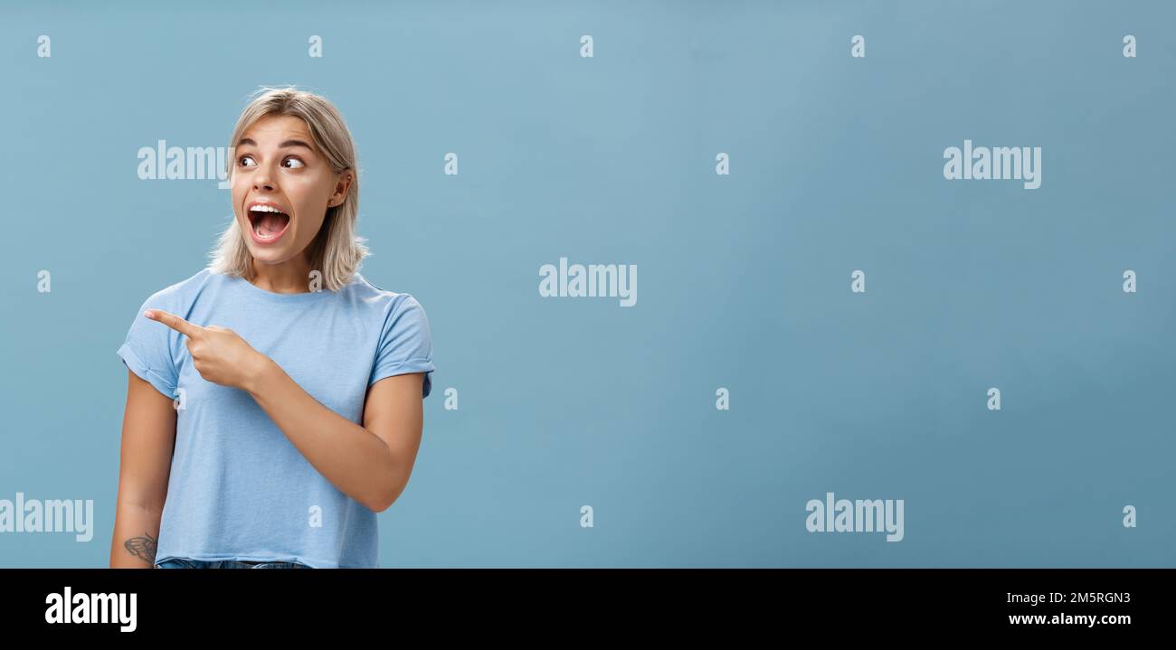 Girl being charmed and excited visiting awesome event pointing and ...