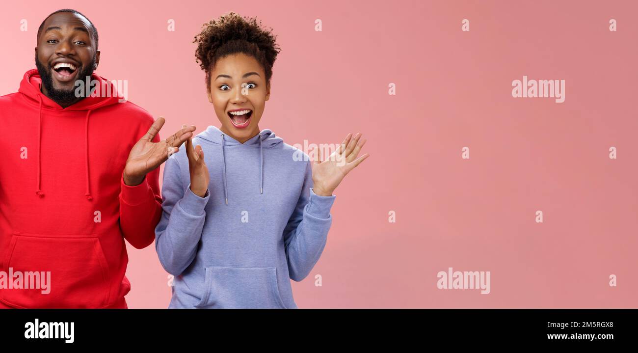 Guys receive nice surprise. Two attractive carefree surprised happy ...