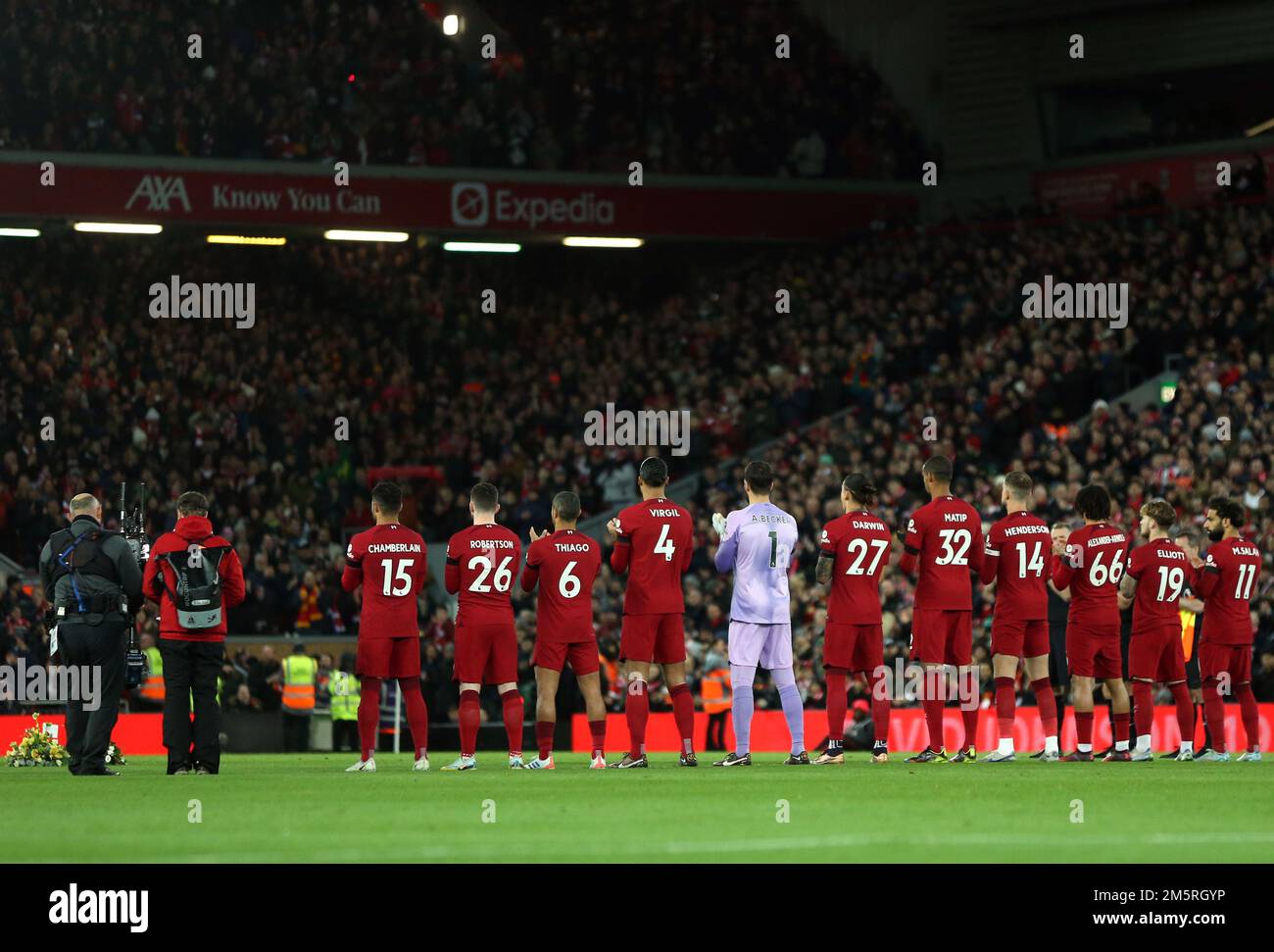 Players observe a minute's applause to mark the death of former players ...