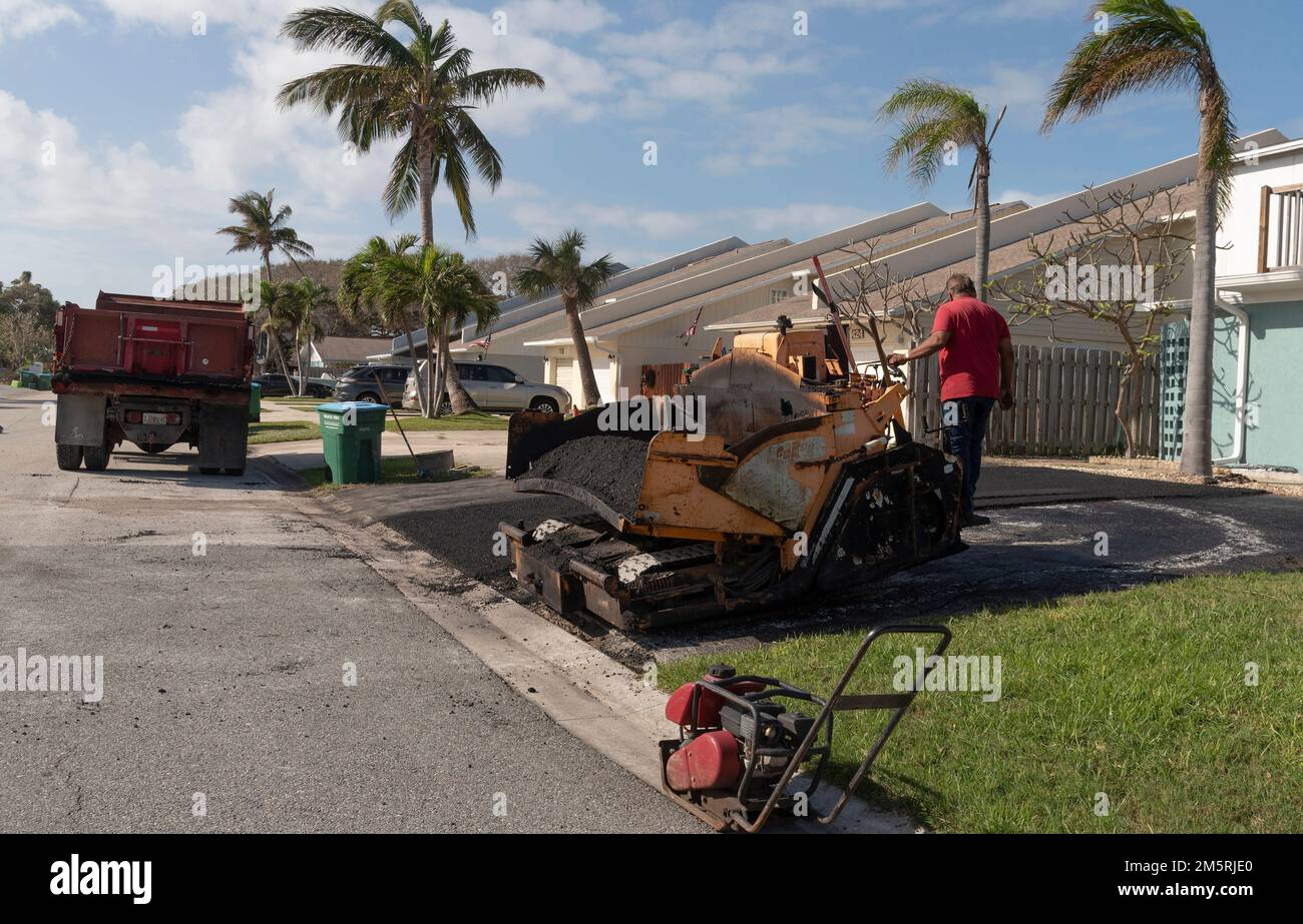 Cocoa Beach, Florida, USA, 2022. Asphalting worker using an asphalt ...