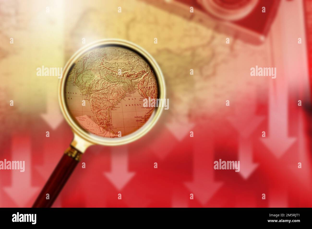 Magnifying glass on vintage retro India map economy downgrade. Vintage ...