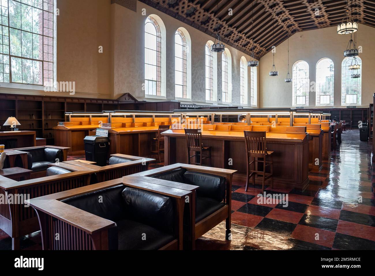 Sunlight falling through arched windows on furniture arranged in UCLA ...