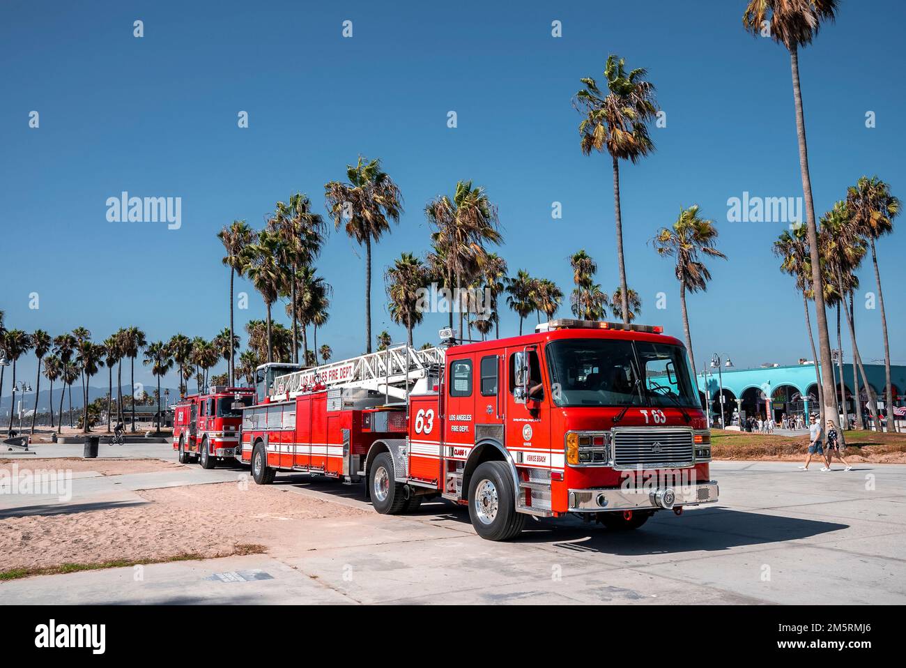 Fire rescue vehicles parked on road at Venice beach during sunny day ...