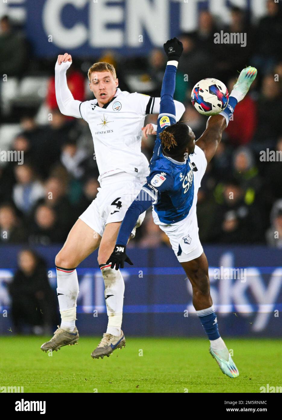 Swansea City's Jay Fulton (left) and Watford’s Tom Dele-Bashiru during ...