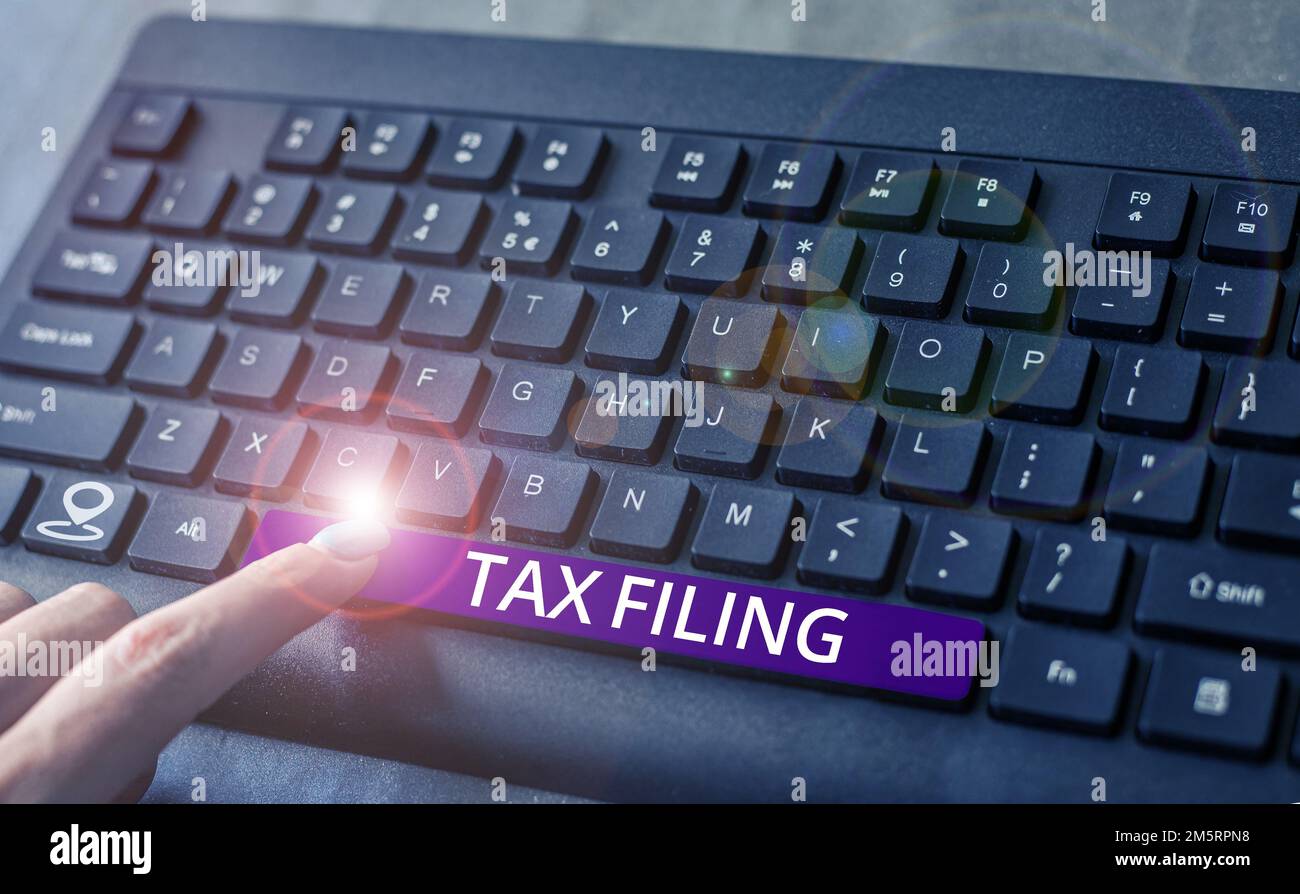 Text caption presenting Tax Filing. Concept meaning Submitting documens ...