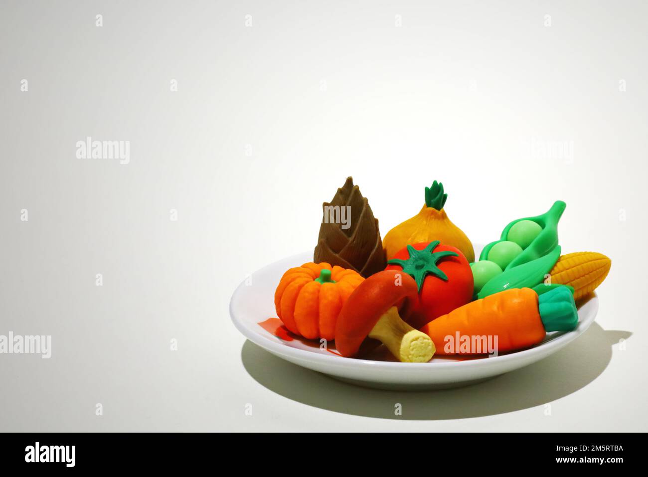 Food model still life with colorful vegetables on a plate Stock Photo ...