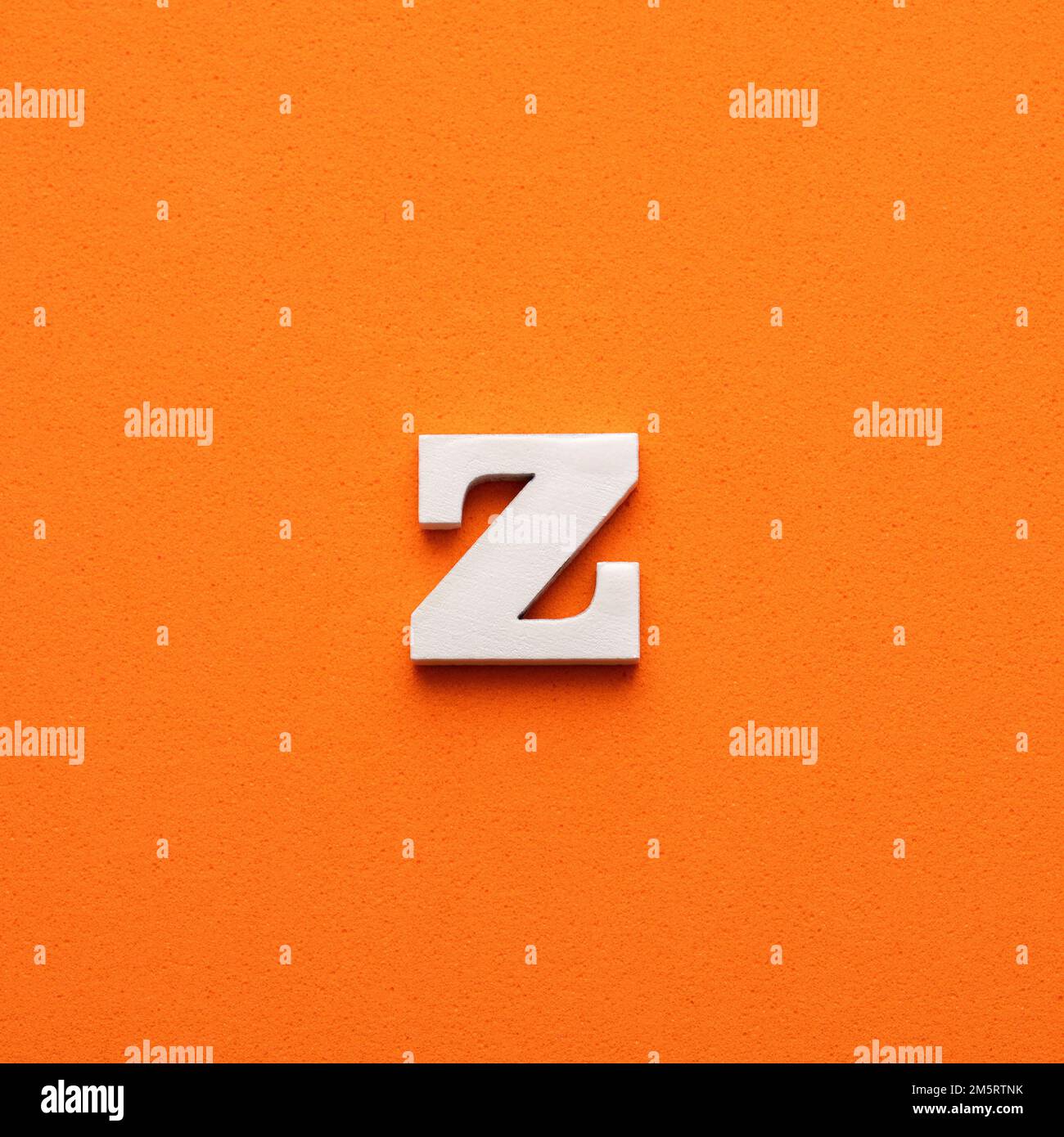 White lowercase letter z on orange foamy background Stock Photo - Alamy