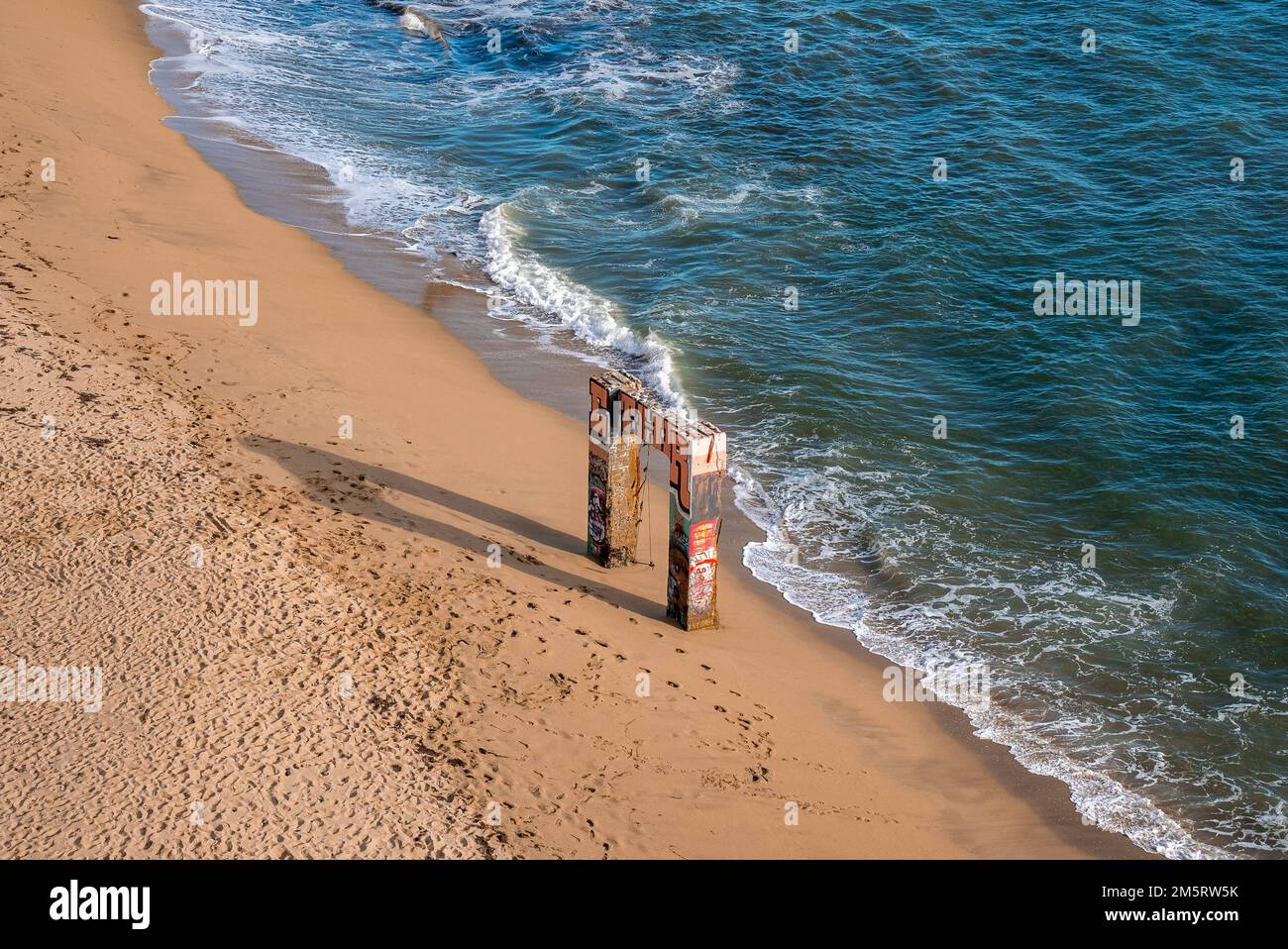 Columns with swing hanging on sandy beach at Pigeon Point Stock Photo ...