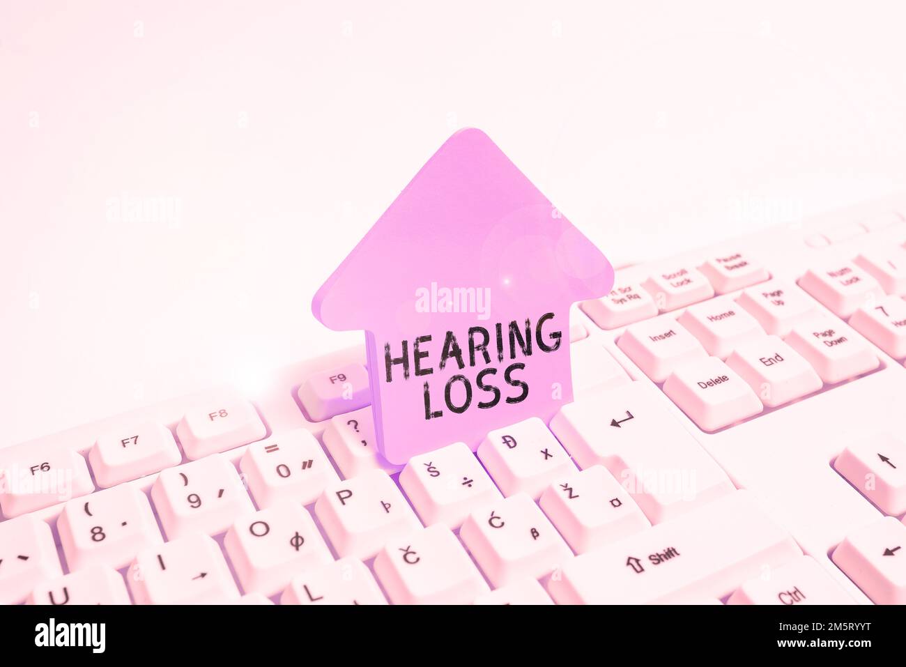 Hand writing sign Hearing Loss. Business concept is partial or total ...
