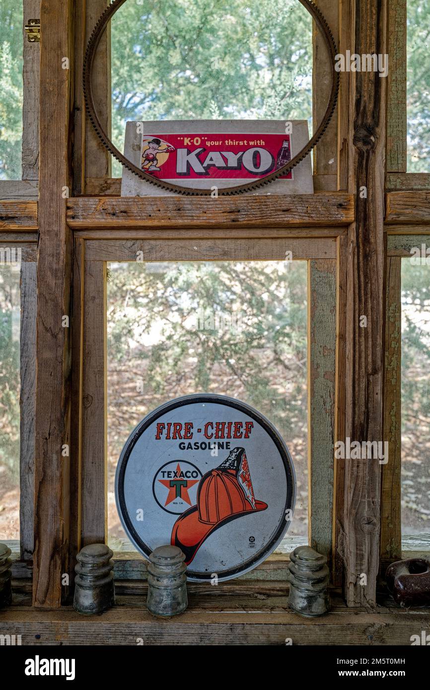 Antique Kayo and Texaco Gasoline signs in a window in Nevada, USA Stock ...